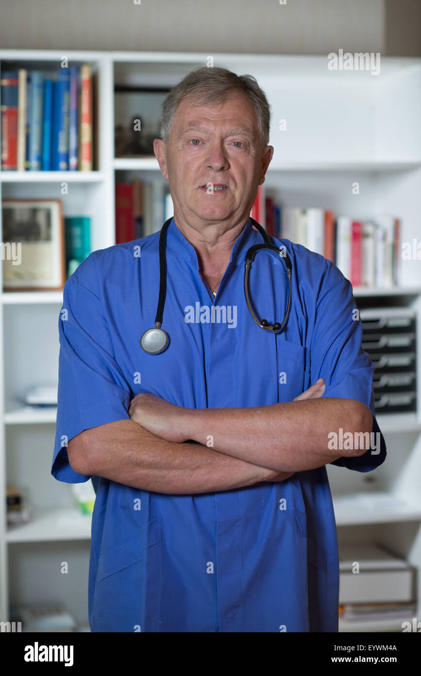 Doctor posing in his office Stock Photo - Alamy