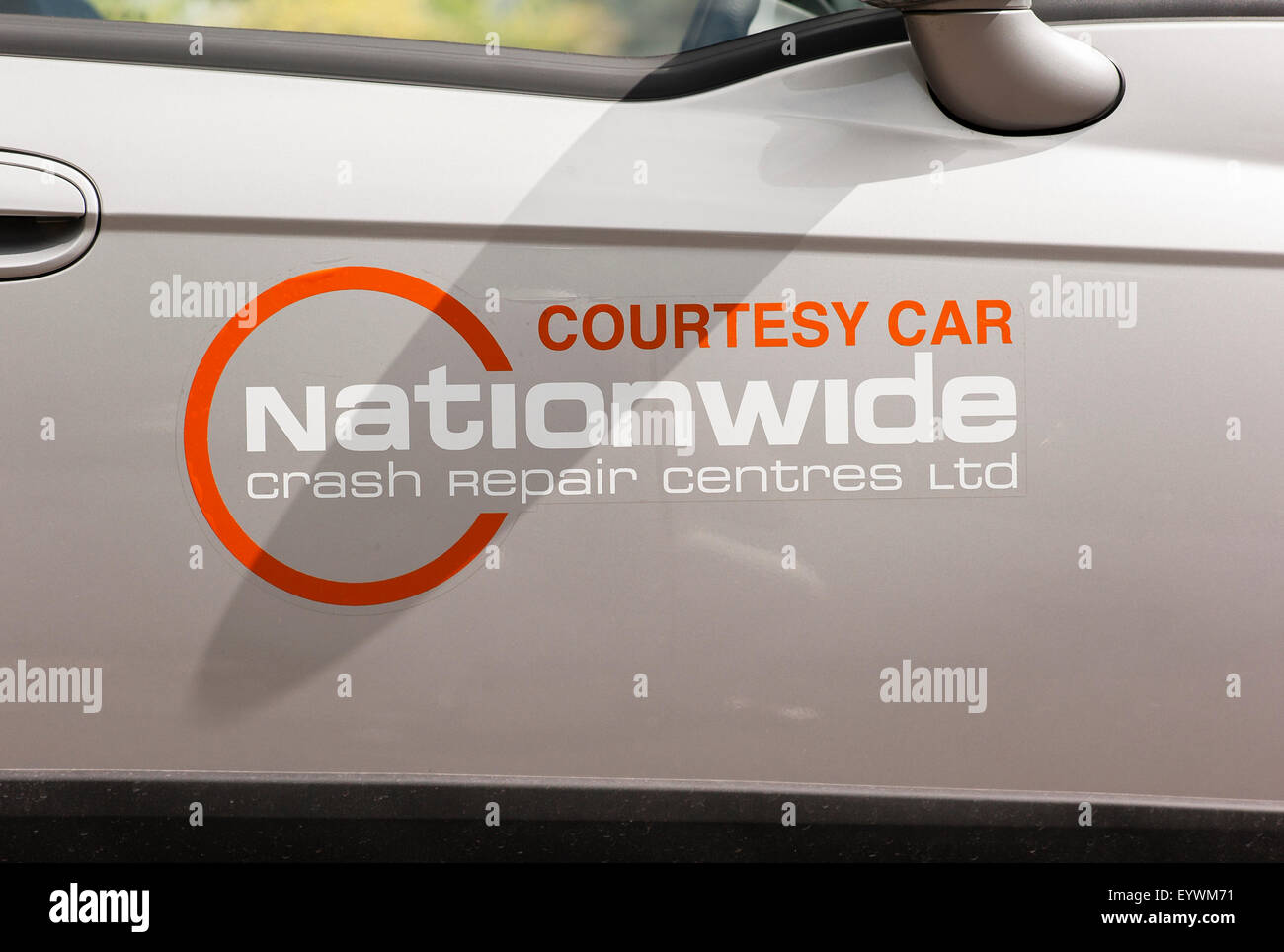 Courtesy car logo on side of loan car Stock Photo - Alamy