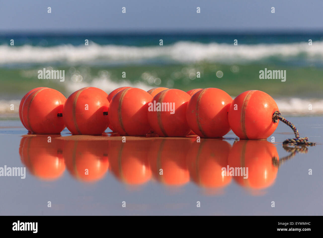 Buoys on ocean beach Stock Photo - Alamy