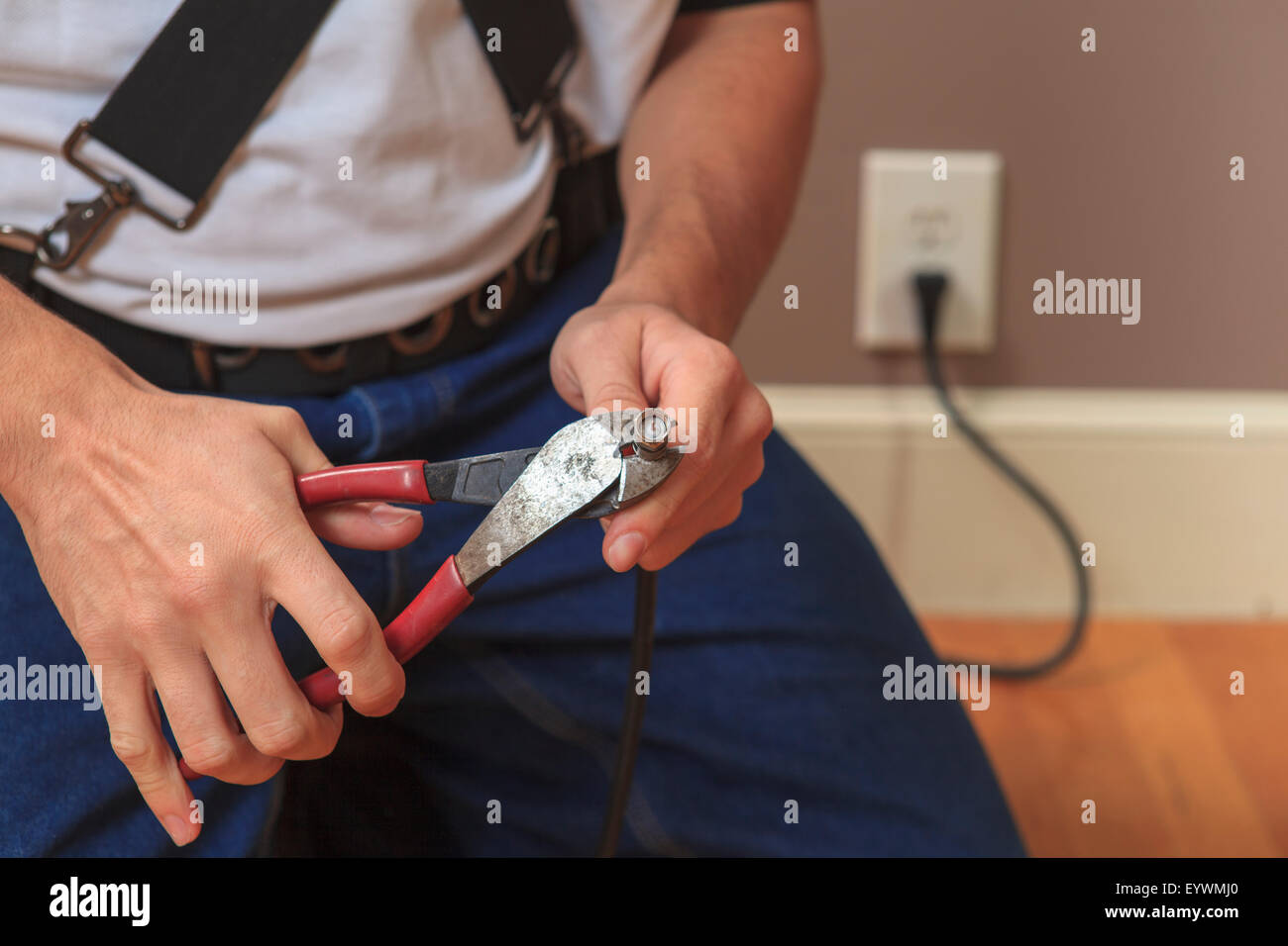 Cable installer cutting old cable connector from the cable Stock Photo ...
