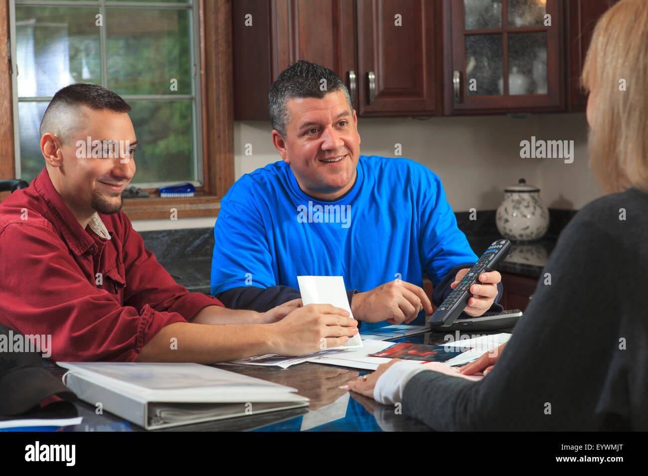 Cable installer doing contract paperwork with home owner Stock Photo ...