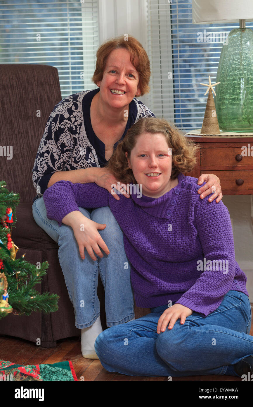 Portrait of a young woman with Autism and her mother at Christmas Stock ...
