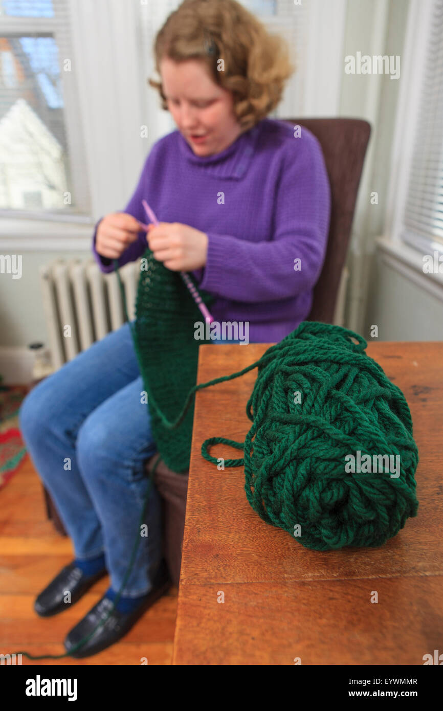 Young woman with Autism doing her knitting Stock Photo - Alamy
