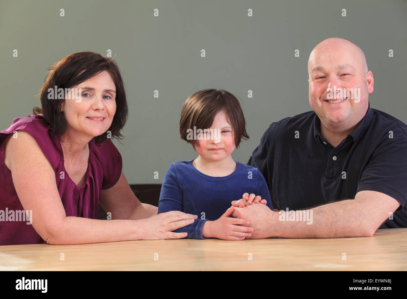 Mother and Father with small daughter with Down Syndrome Stock Photo ...