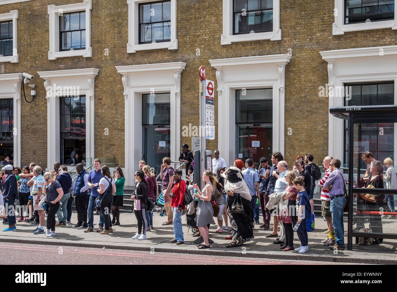 People waiting at bus stop hi-res stock photography and images - Alamy