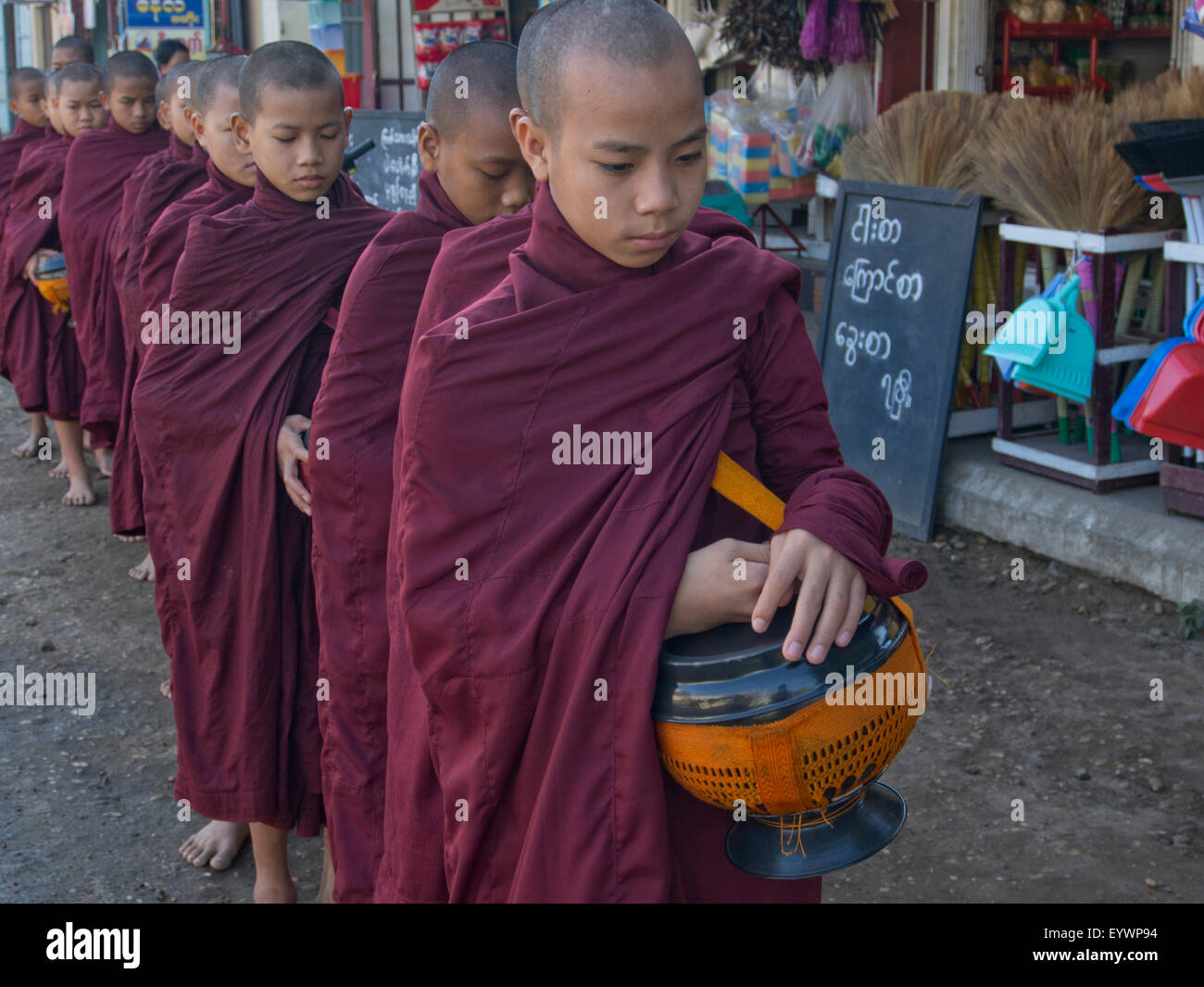 Young monks receiving food gifts in Bagan, Myanmar (Burma), Asia Stock ...
