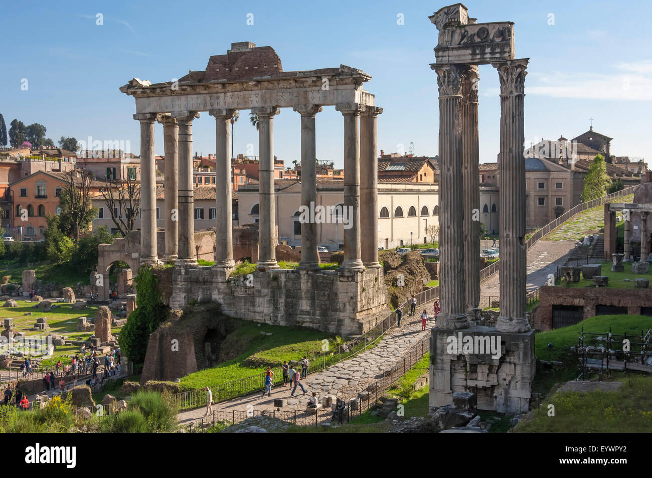 Ancient Roman Road traverses the columns and ruins in the Forum of ...