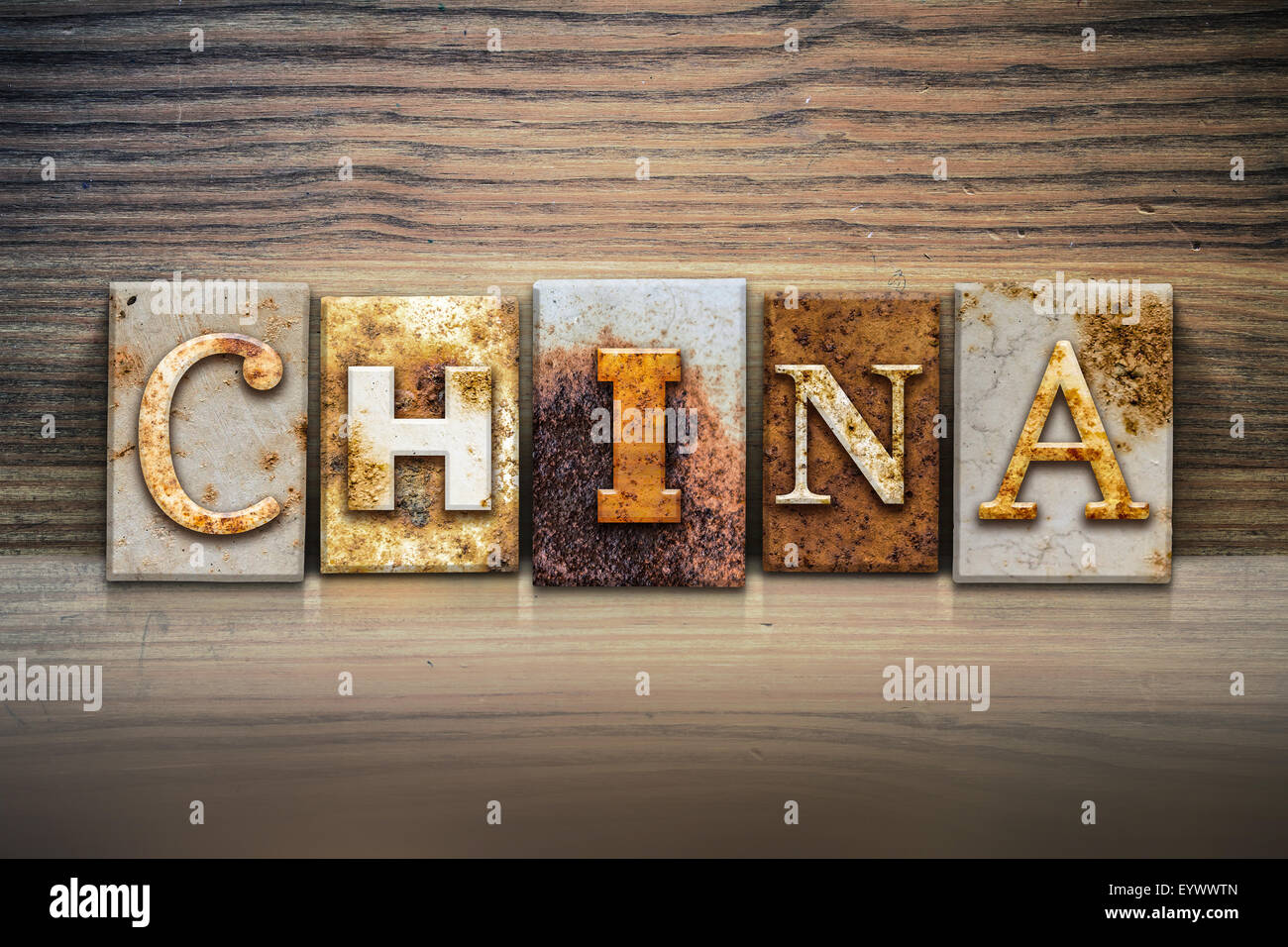 The word "CHINA" written in rusty metal letterpress type sitting on a ...