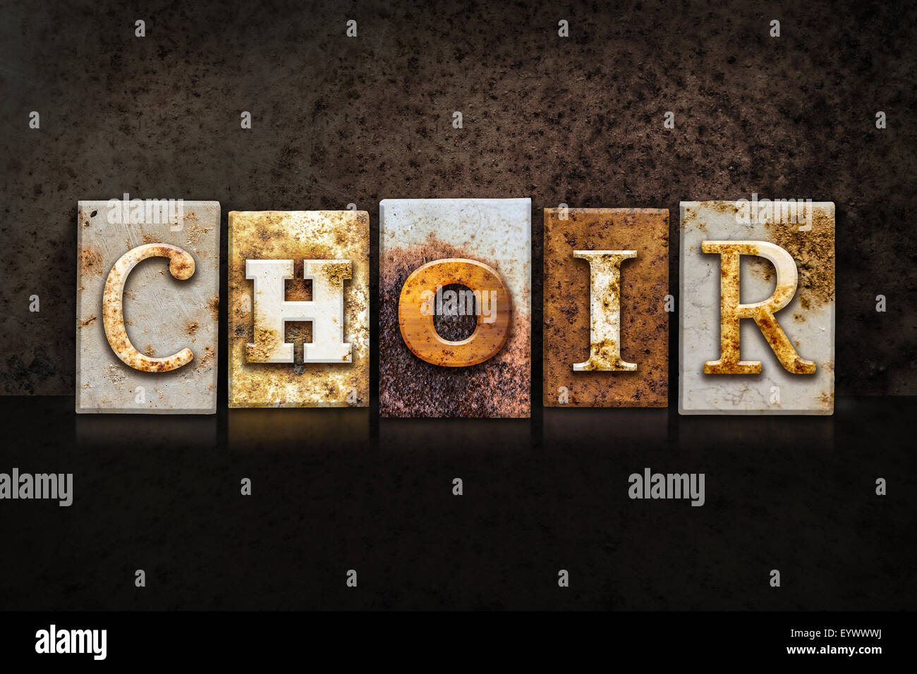 The word "CHOIR" written in rusty metal letterpress type on a dark ...