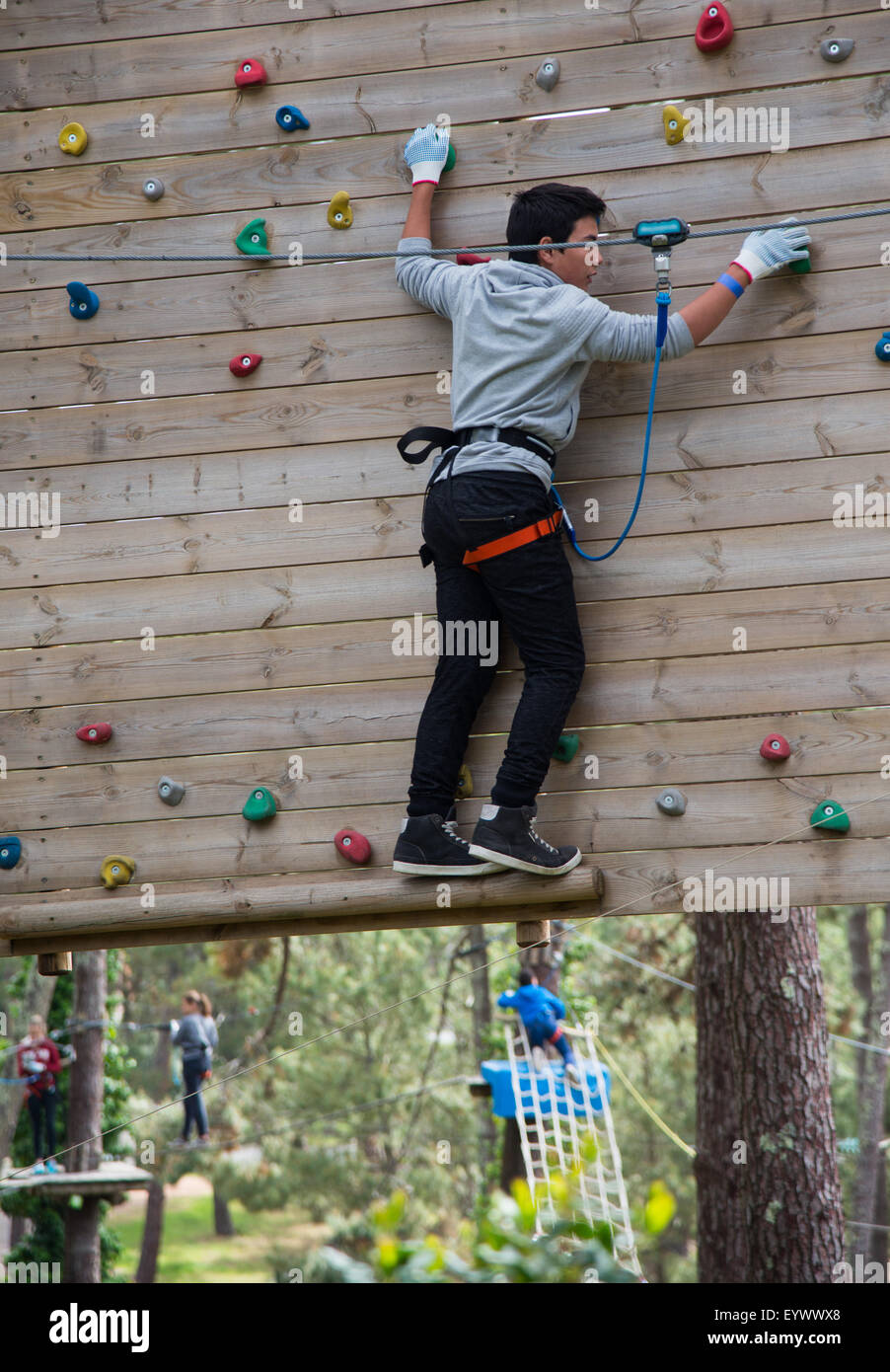 Climbing wall boy teen hi-res stock photography and images - Alamy