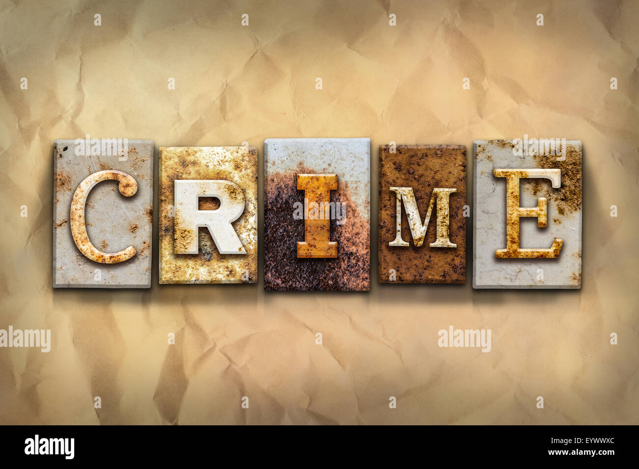 The word "CRIME" written in rusty metal letterpress type on a crumbled ...