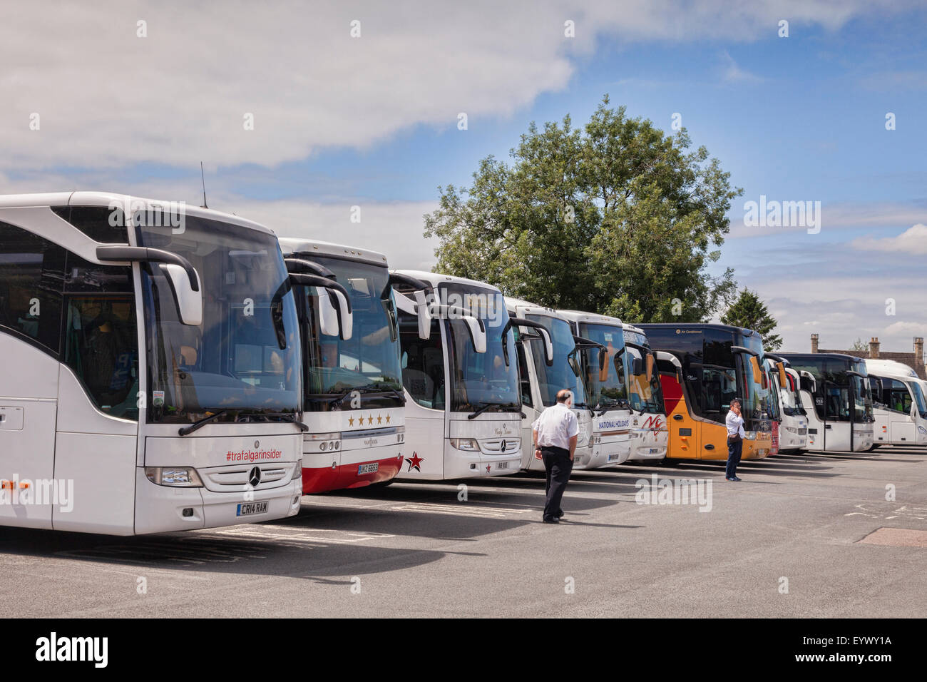 Tour coaches lined up in the Cotswold village of Bourton-on-the-Water ...