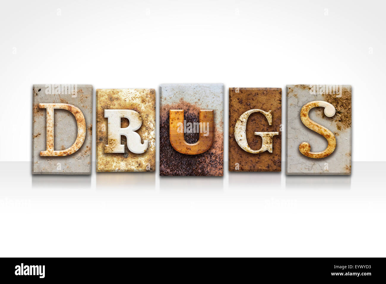 The word "DRUGS" written in rusty metal letterpress type isolated on a ...