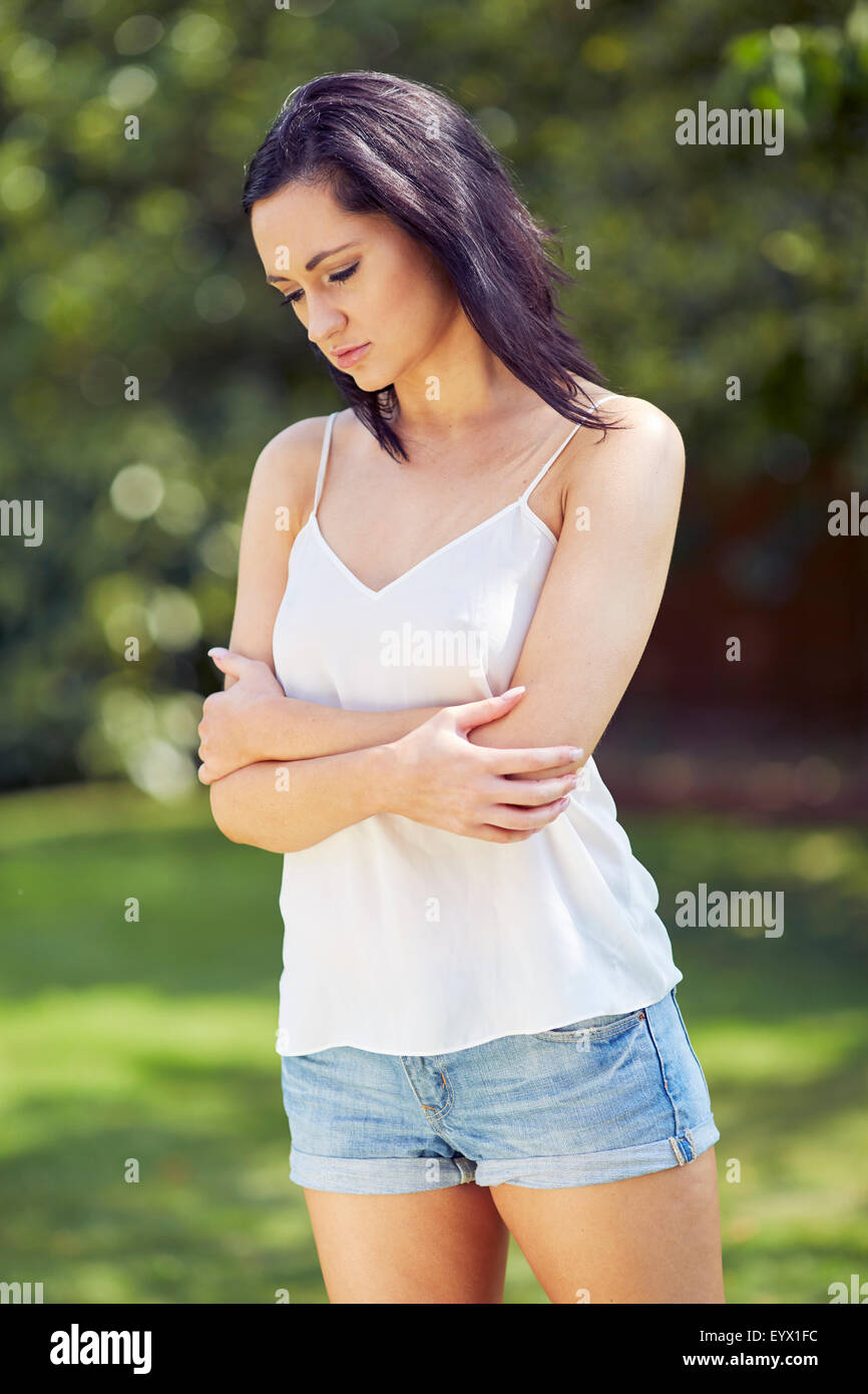 Thoughtful looking girl outdoors Stock Photo - Alamy
