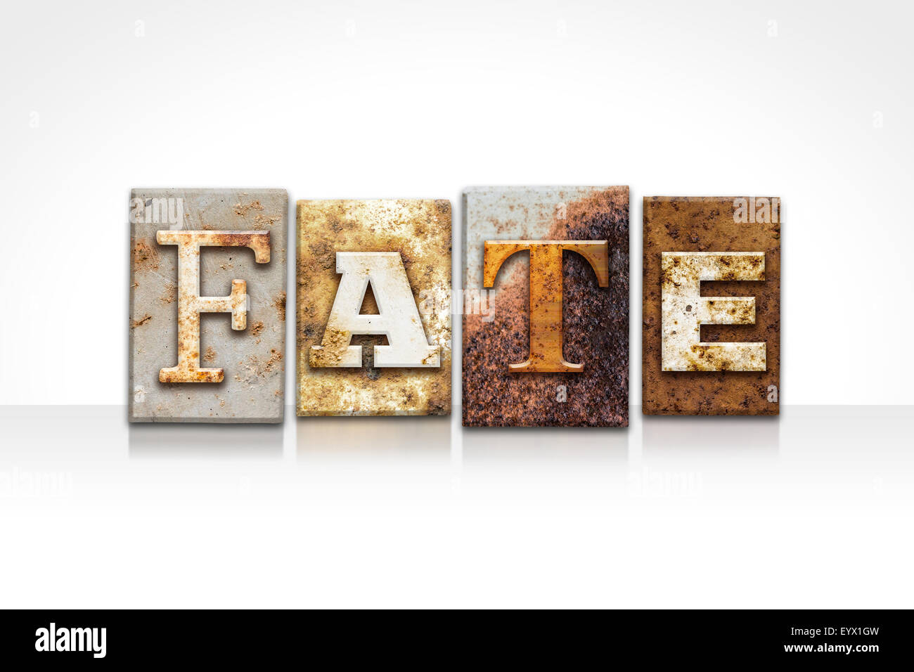 The word "FATE" written in rusty metal letterpress type isolated on a ...