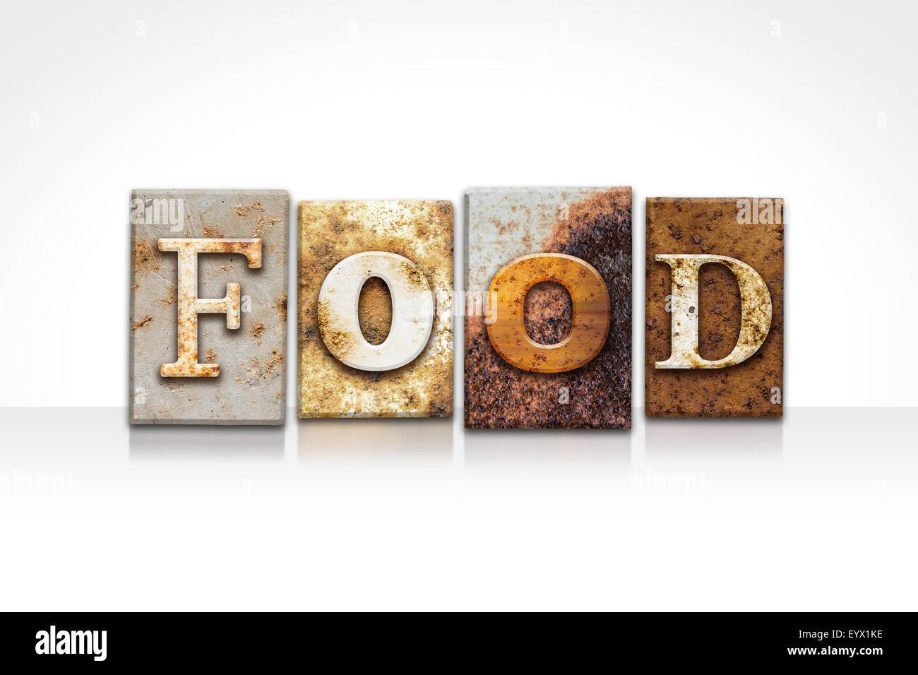 The word "FOOD" written in rusty metal letterpress type isolated on a ...
