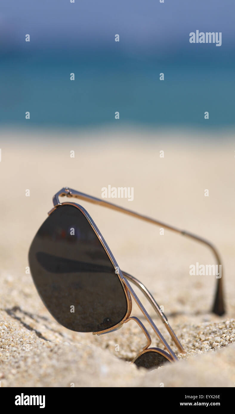 discarded sun glasses in sand on beach Stock Photo - Alamy