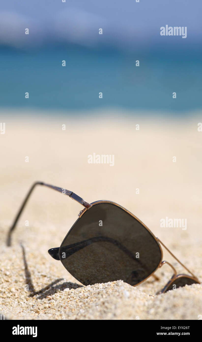 discarded sun glasses in sand on beach Stock Photo - Alamy