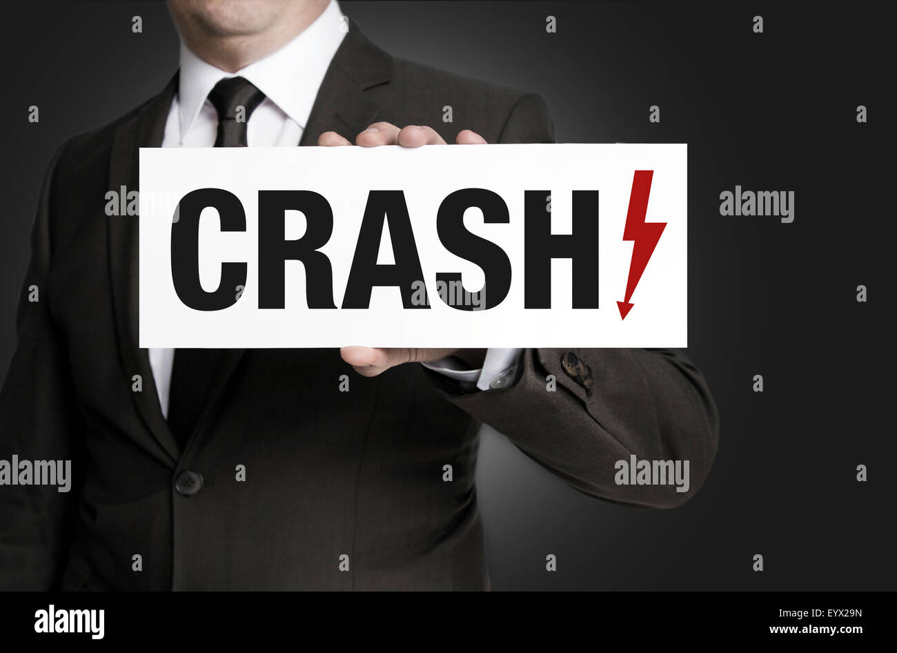Crash sign is held by businessman Stock Photo - Alamy