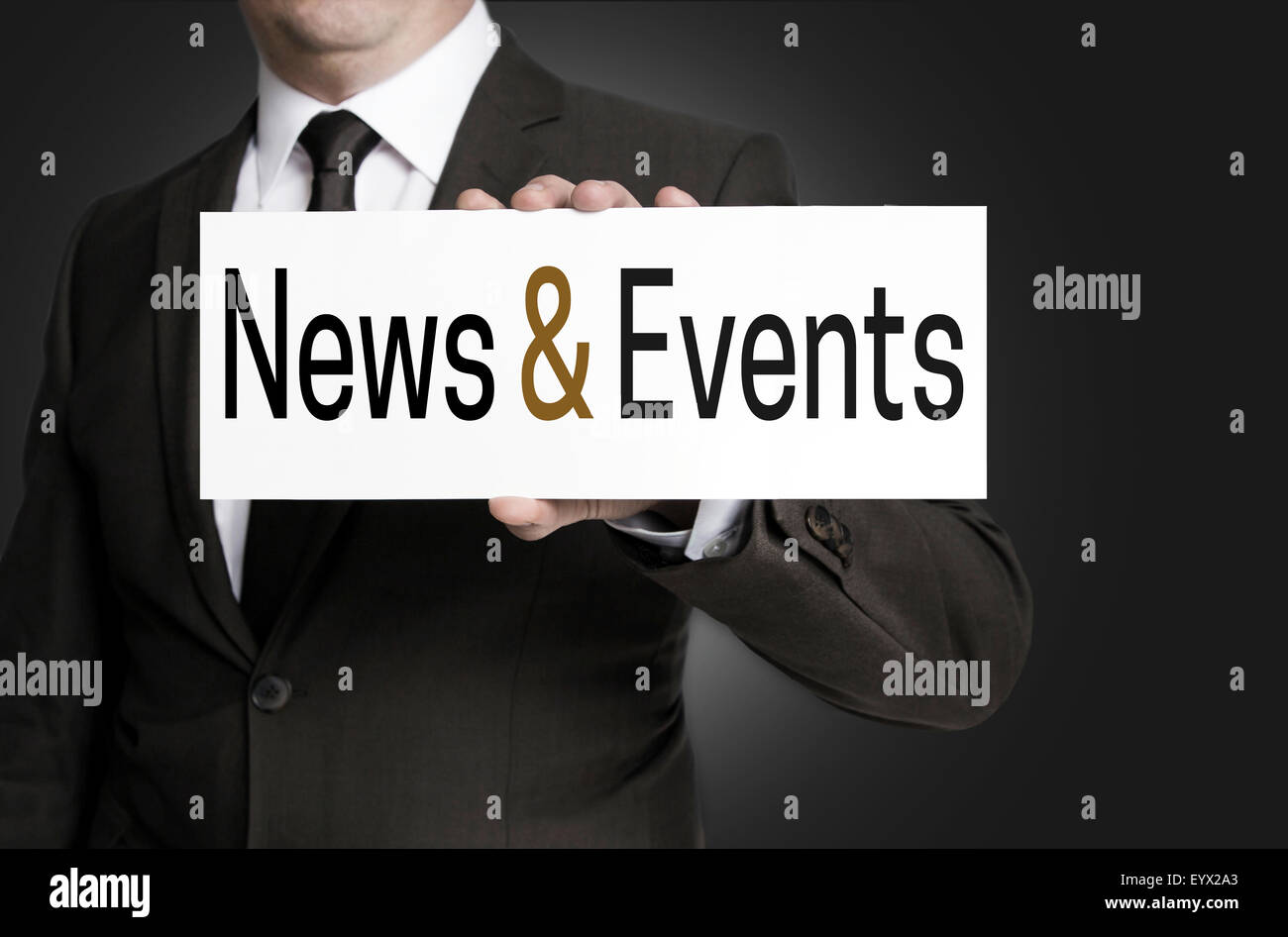 News and events sign is held by businessman Stock Photo - Alamy