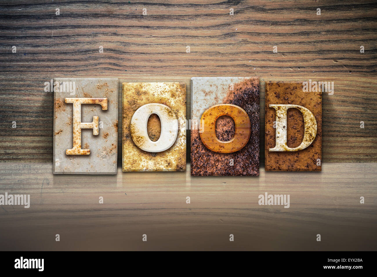 The word "FOOD" written in rusty metal letterpress type sitting on a ...