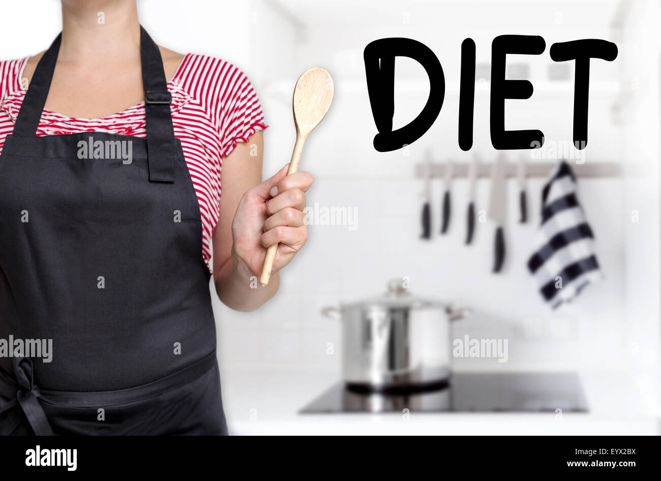 diet cook holding wooden spoon background Stock Photo - Alamy