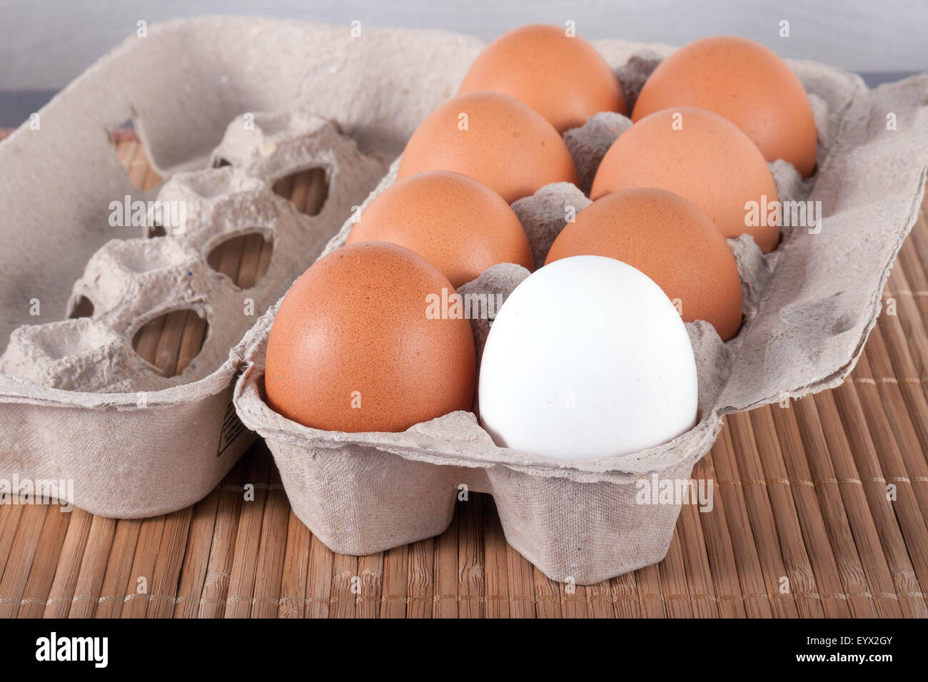 Raw eggs in a cardboard container Stock Photo - Alamy