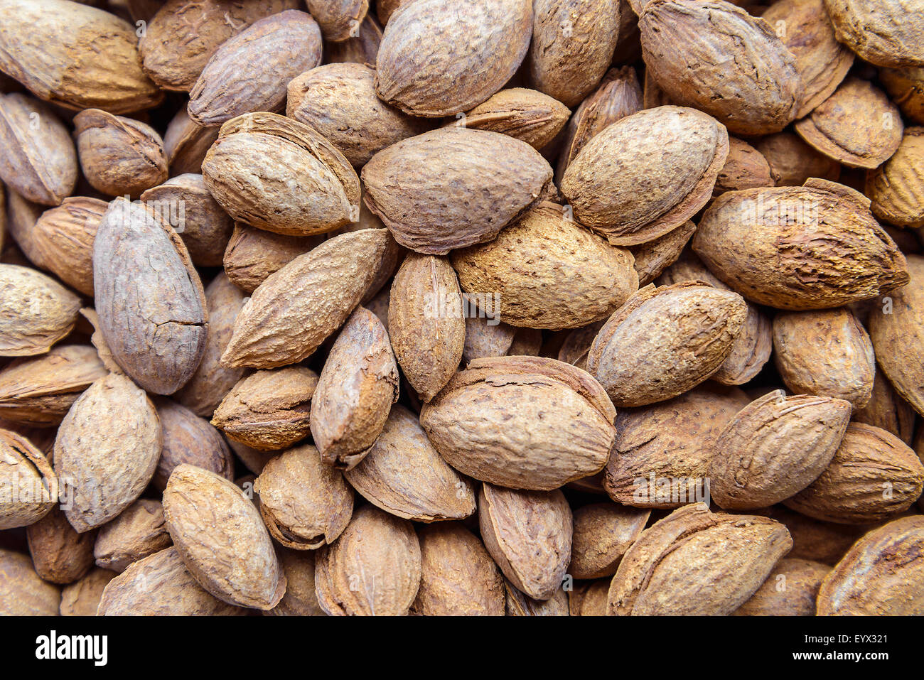 A bunch of unshelled almonds photographed close up Stock Photo - Alamy