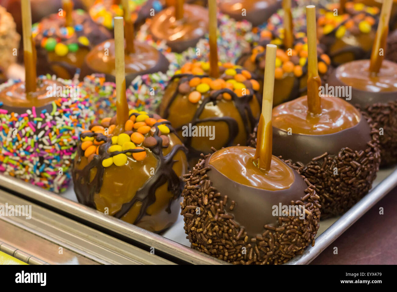 Tray of assorted variety of candy apples at state fair Stock Photo - Alamy