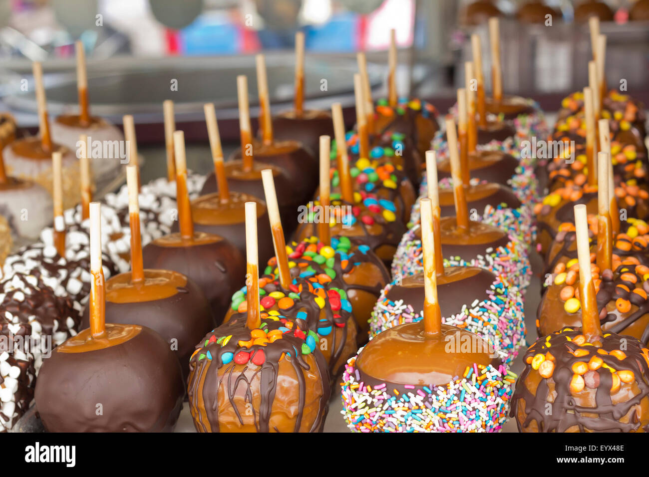 Tray of assorted variety of candy apples at state fair Stock Photo - Alamy