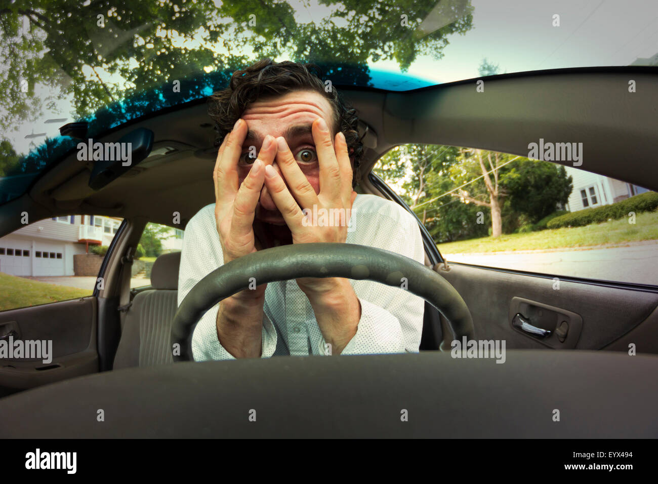 Silly man gets into car crash and makes ridiculous face Stock Photo - Alamy