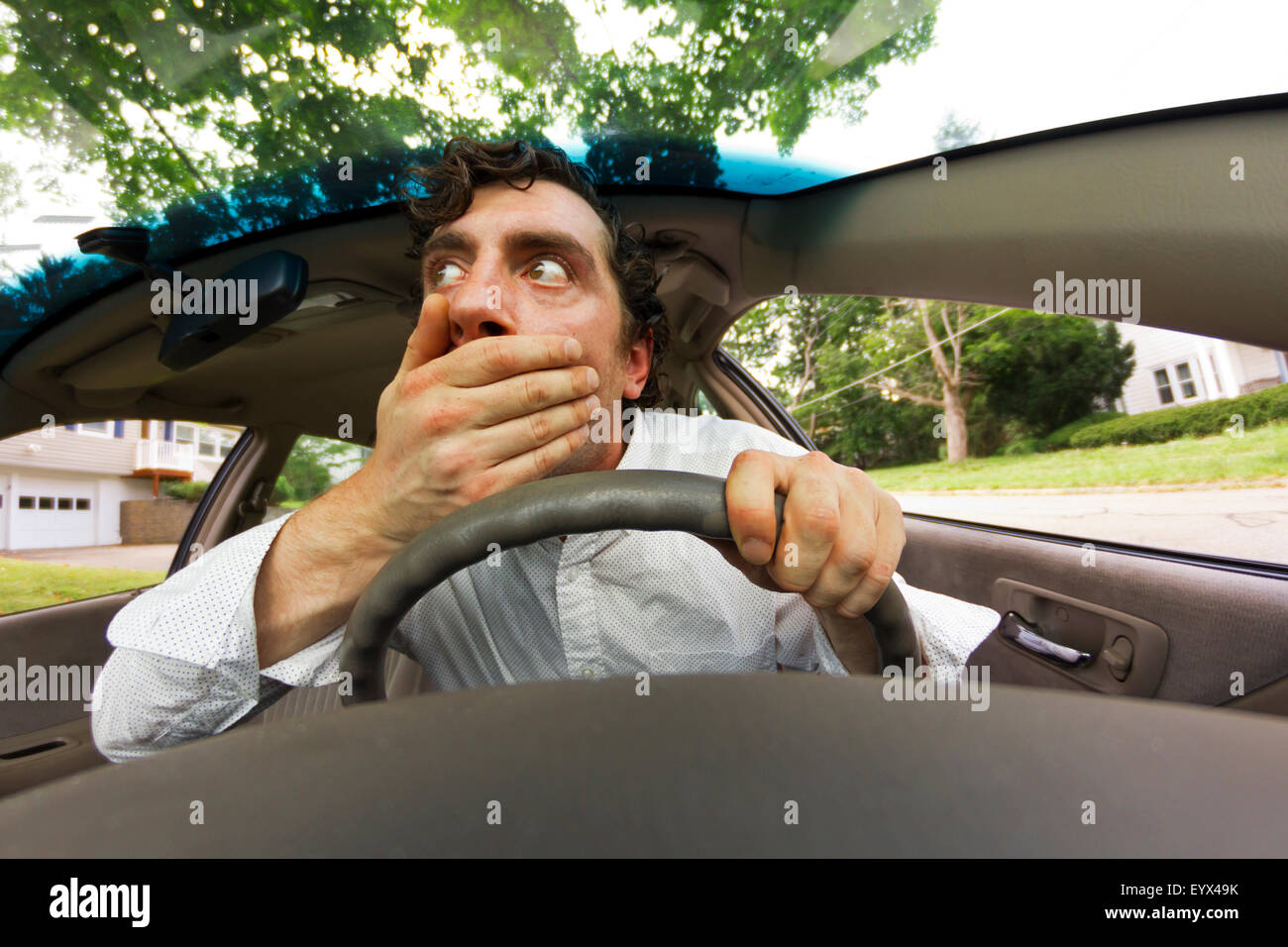 Silly man gets into car crash and makes ridiculous face Stock Photo - Alamy