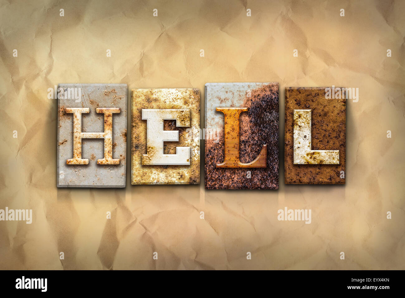 The word "HELL" written in rusty metal letterpress type on a crumbled ...
