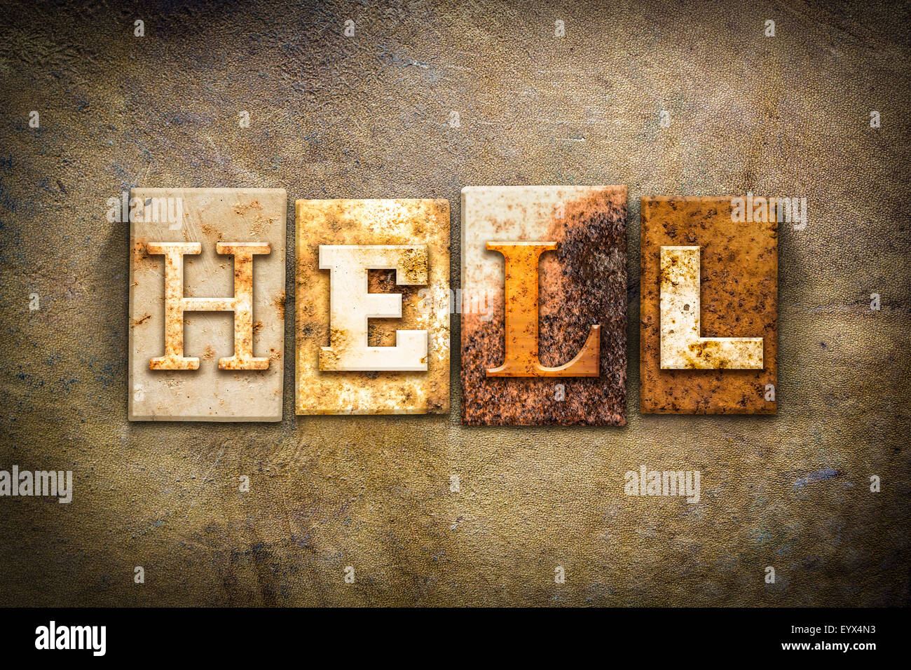 The word "HELL" written in rusty metal letterpress type on an old aged ...