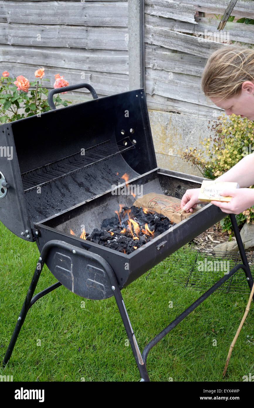 A barbecue in the process of being lit Stock Photo - Alamy