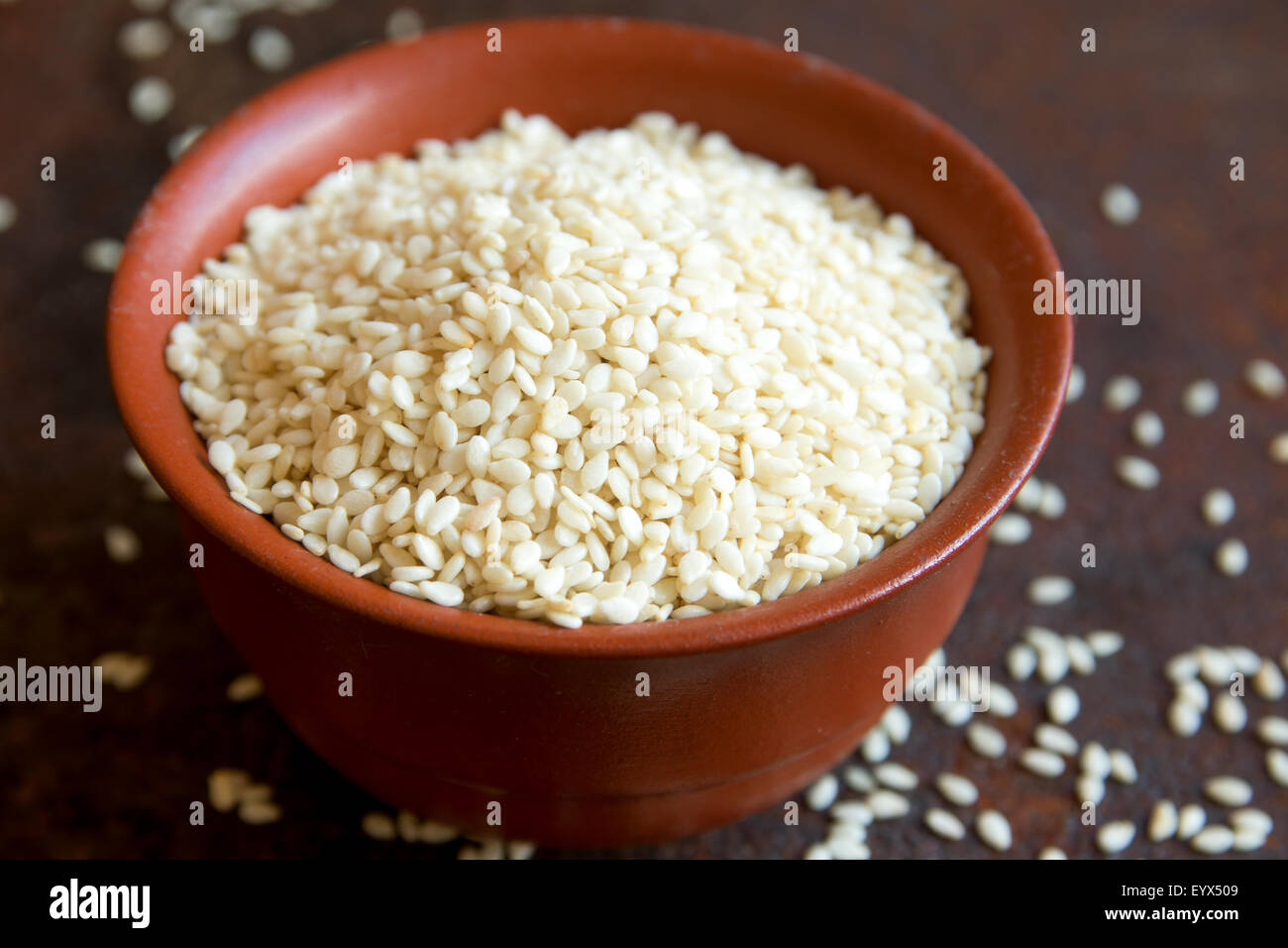 Sesame seeds in bowl close up Stock Photo - Alamy
