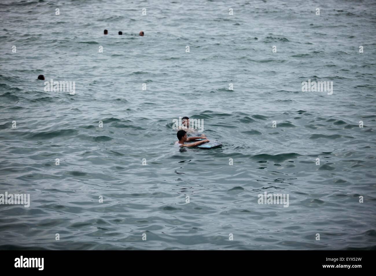 Gaza City, Gaza Strip, Palestinian Territory. 4th Aug, 2015. Palestinians swim in the ...