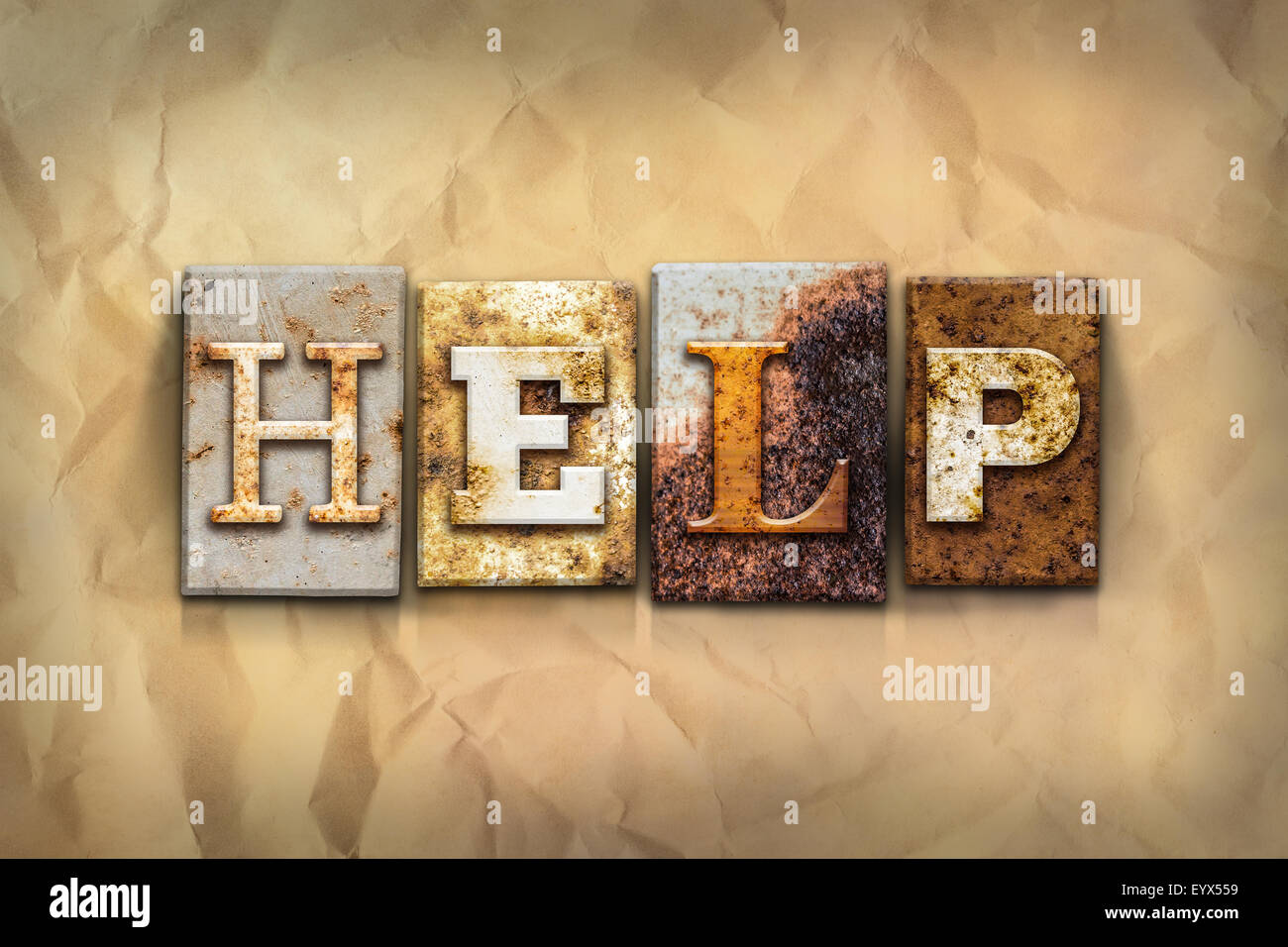 The word "HELP" written in rusty metal letterpress type on a crumbled ...