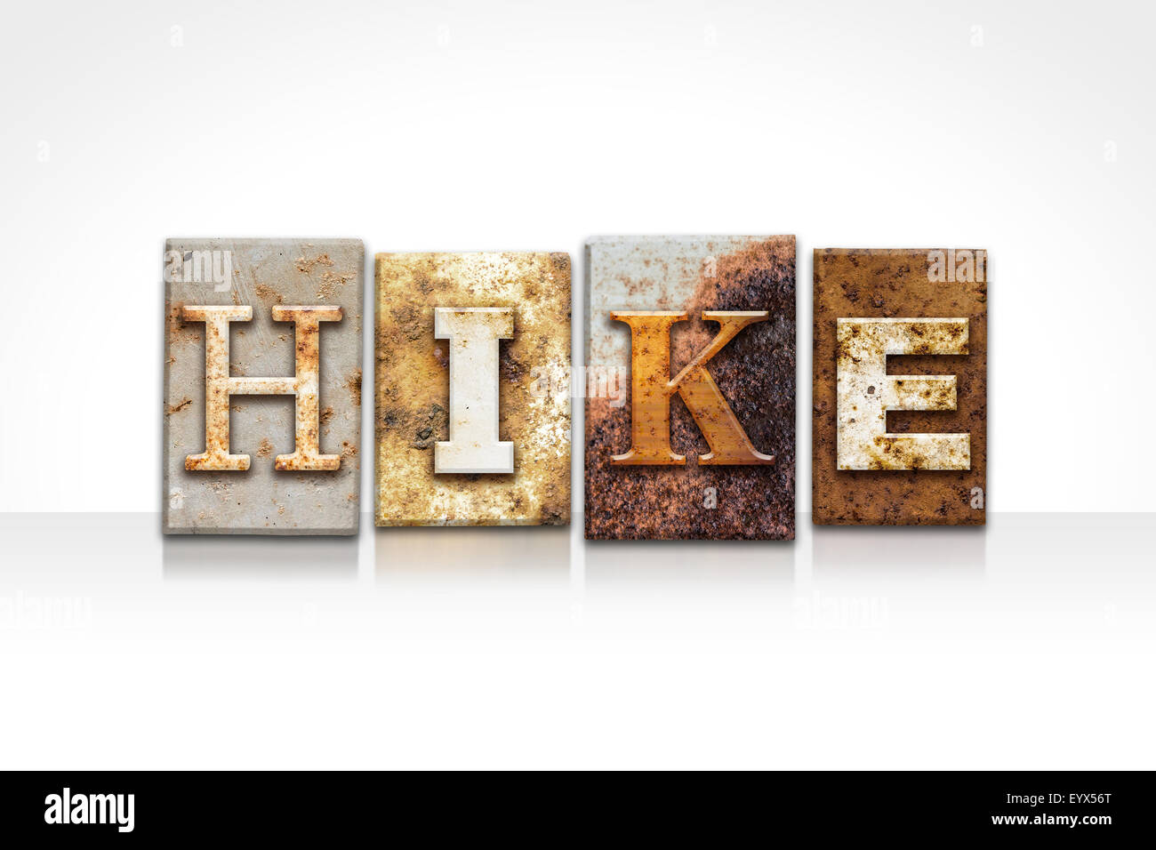 The word "HIKE" written in rusty metal letterpress type isolated on a ...