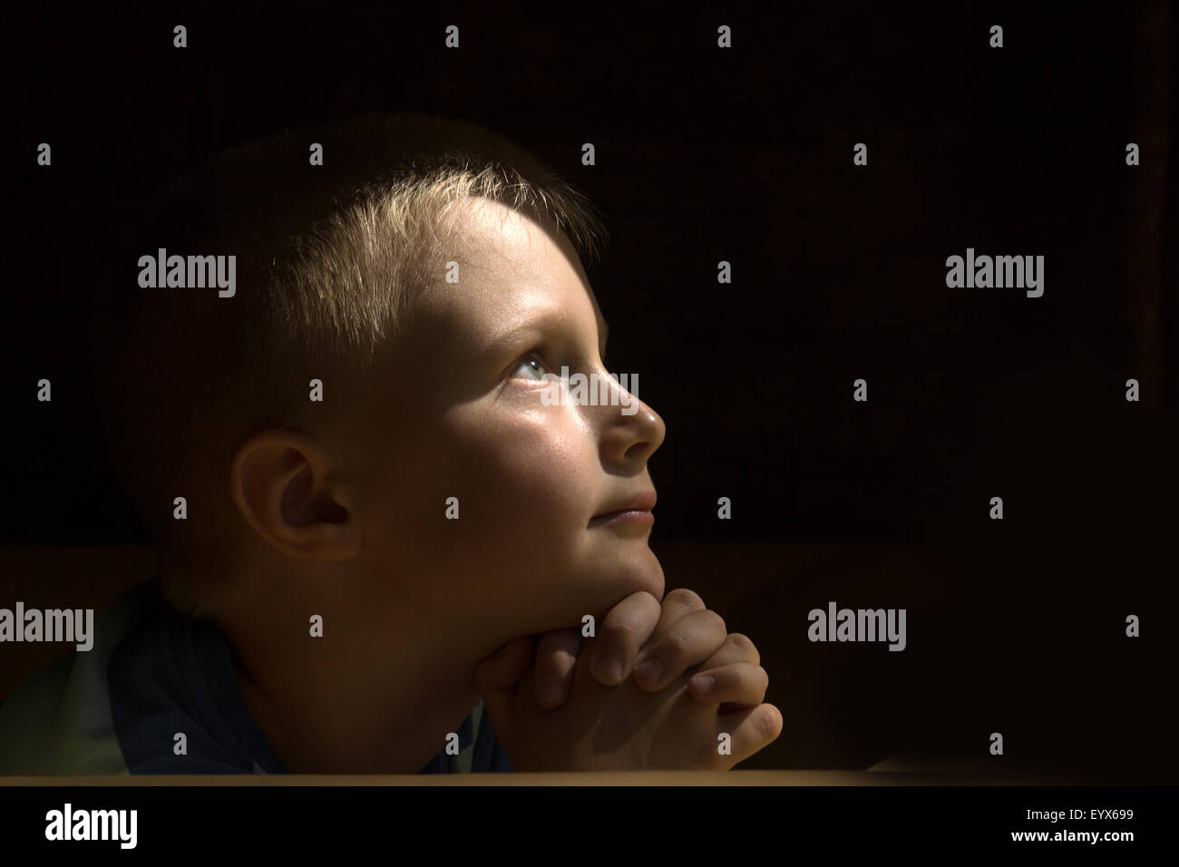 Little young beautiful boy (child, kid) spiritual peaceful praying and ...