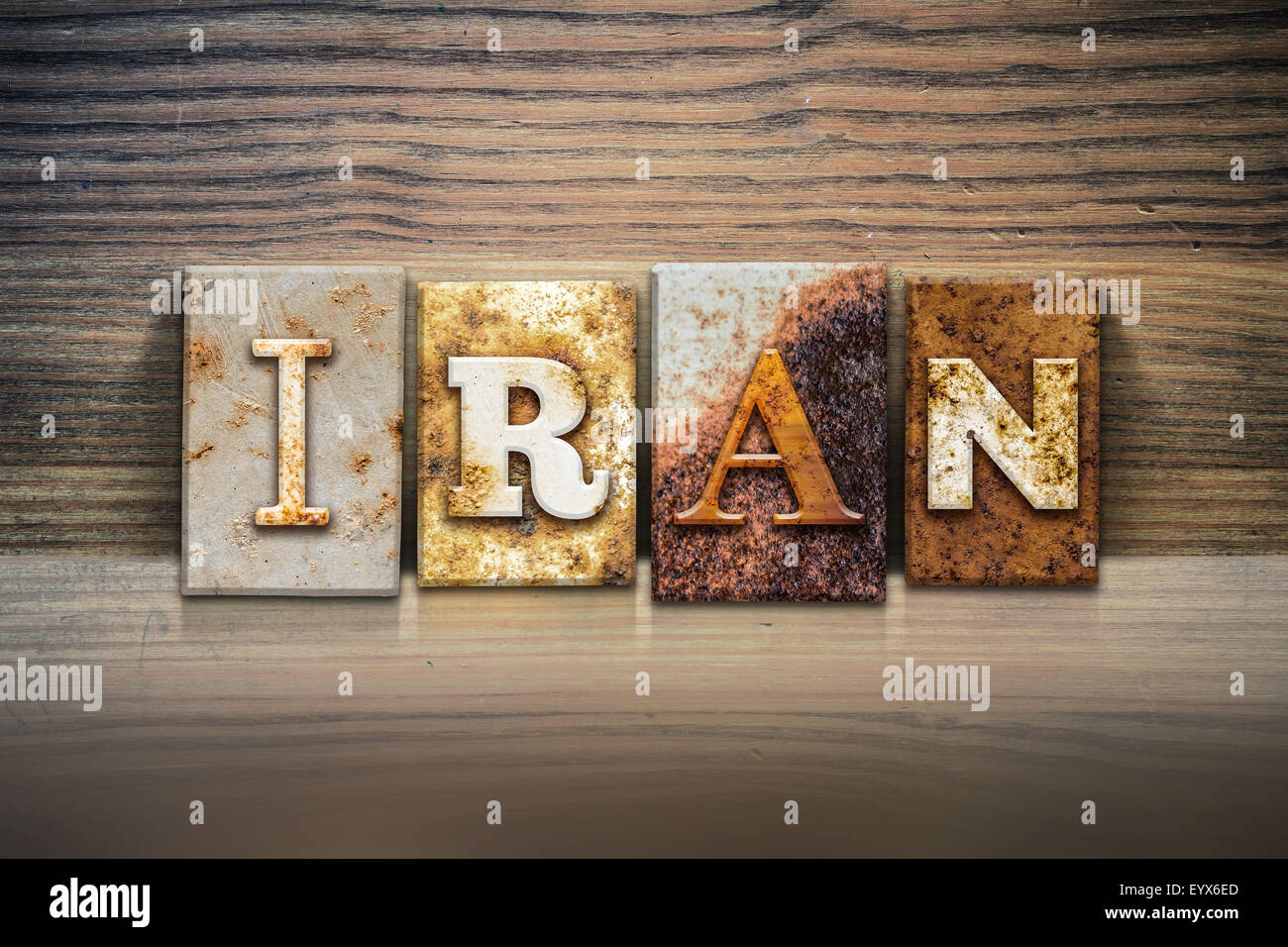 The word "IRAN" written in rusty metal letterpress type sitting on a ...