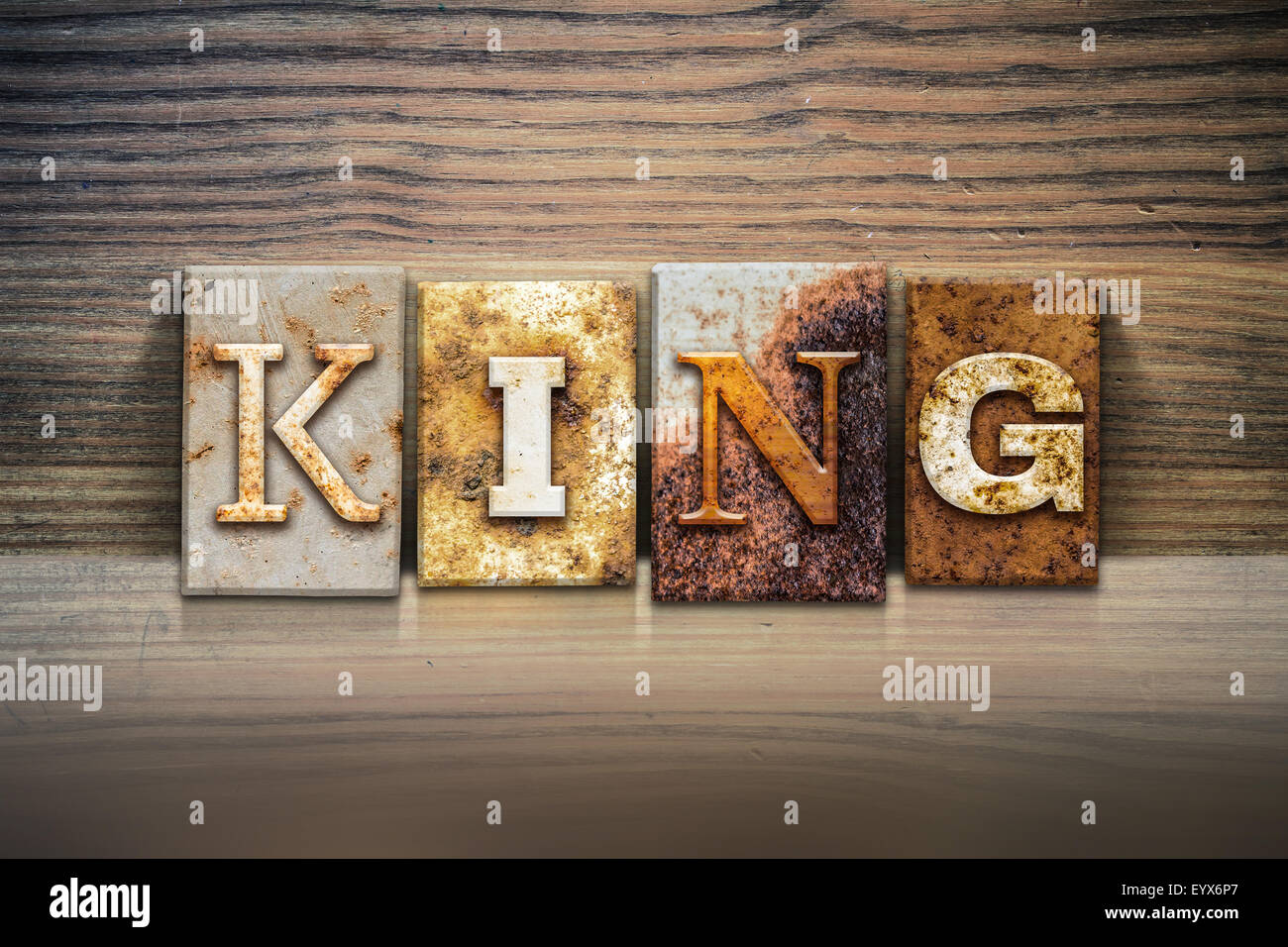 The word "KING" written in rusty metal letterpress type sitting on a ...