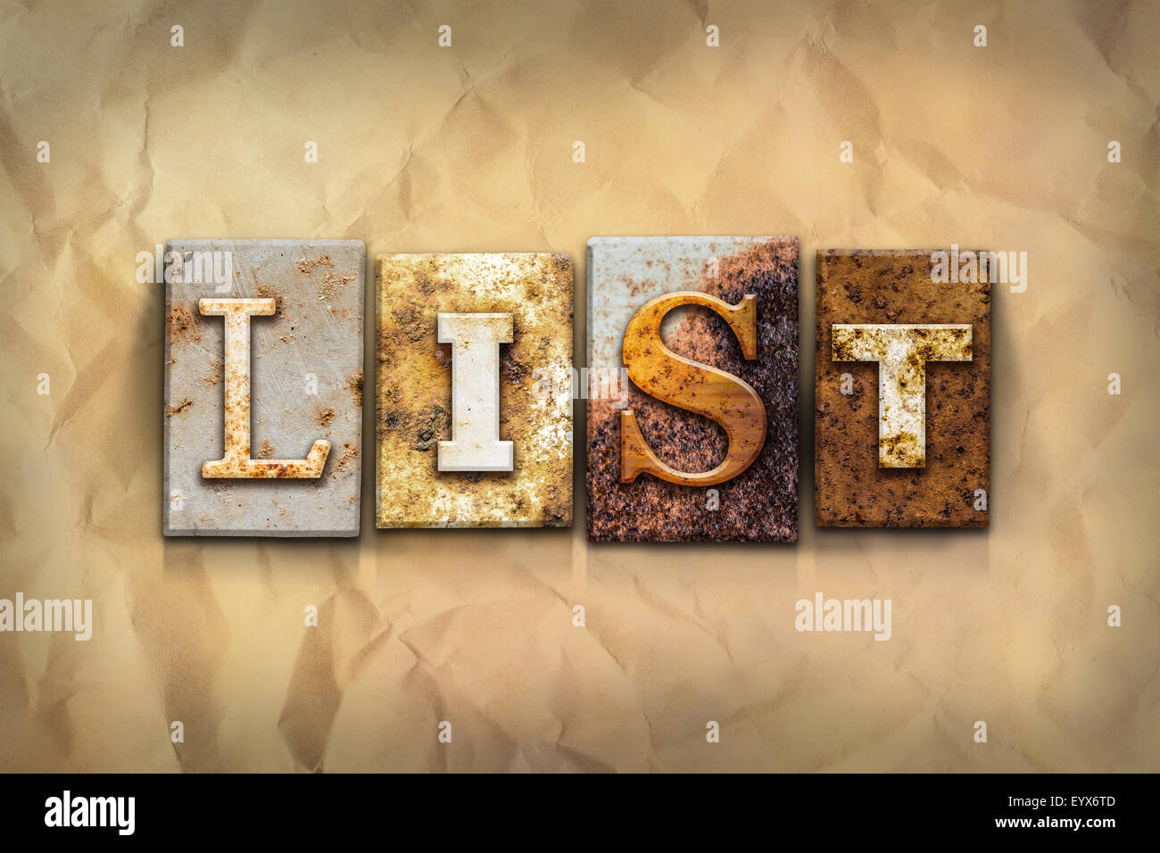 The word "LIST" written in rusty metal letterpress type on a crumbled ...