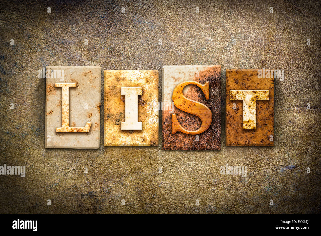 The word "LIST" written in rusty metal letterpress type on an old aged ...