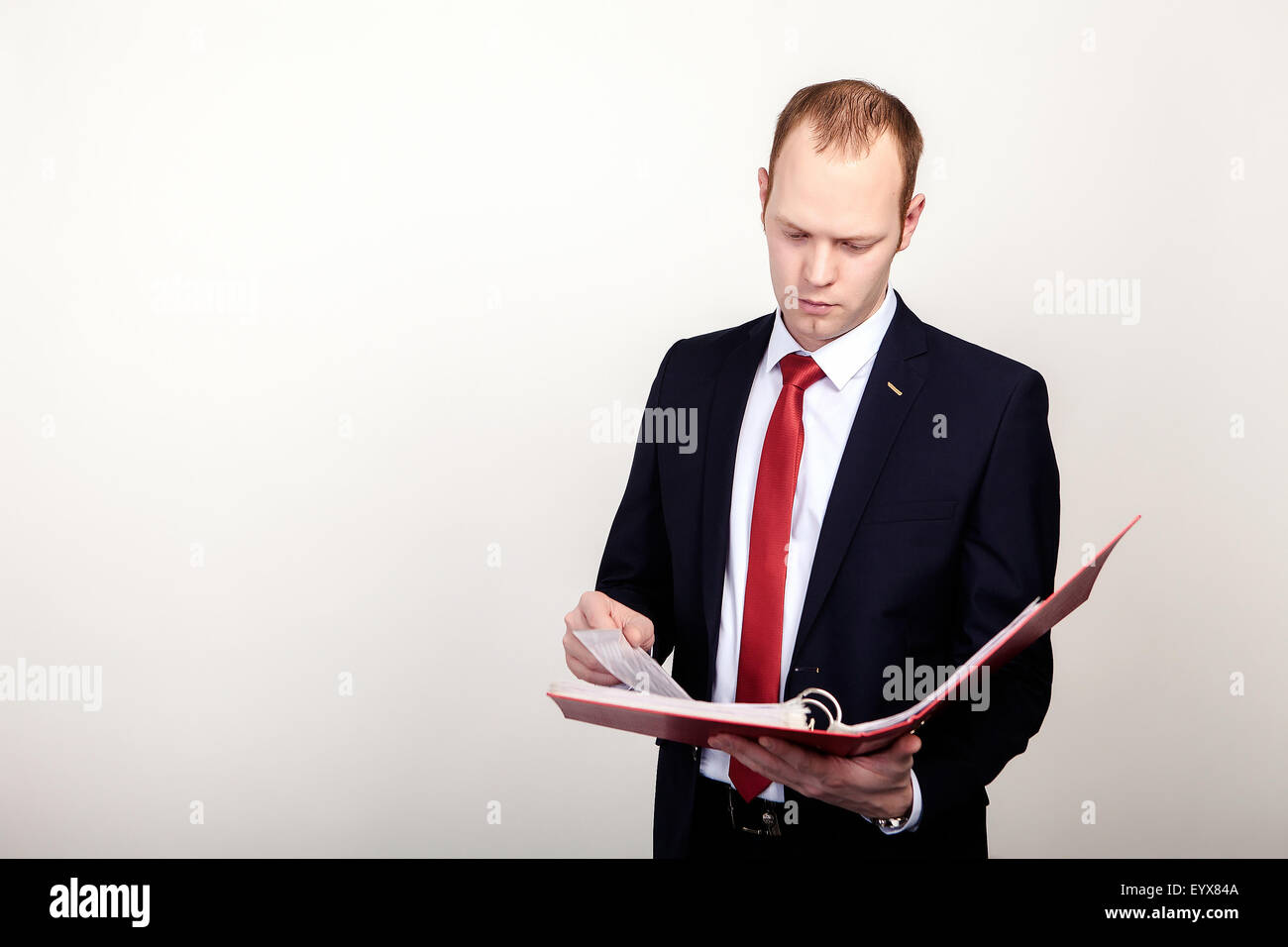 businessman holding a folder Isolated on white background Stock Photo ...