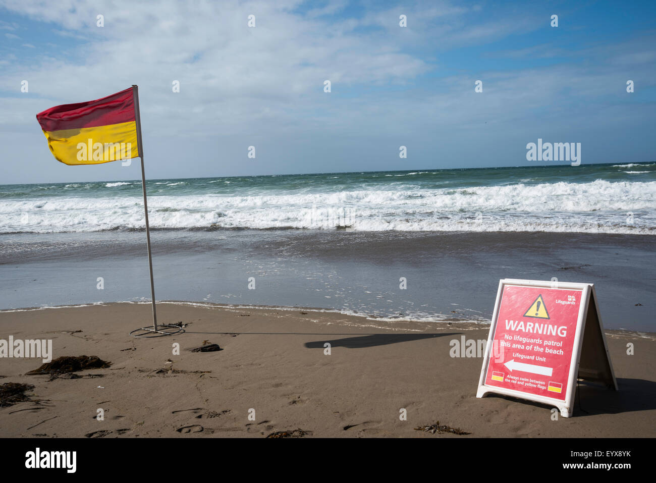 Surf lifesaving, warning flags and equipment on beach ready for use by ...