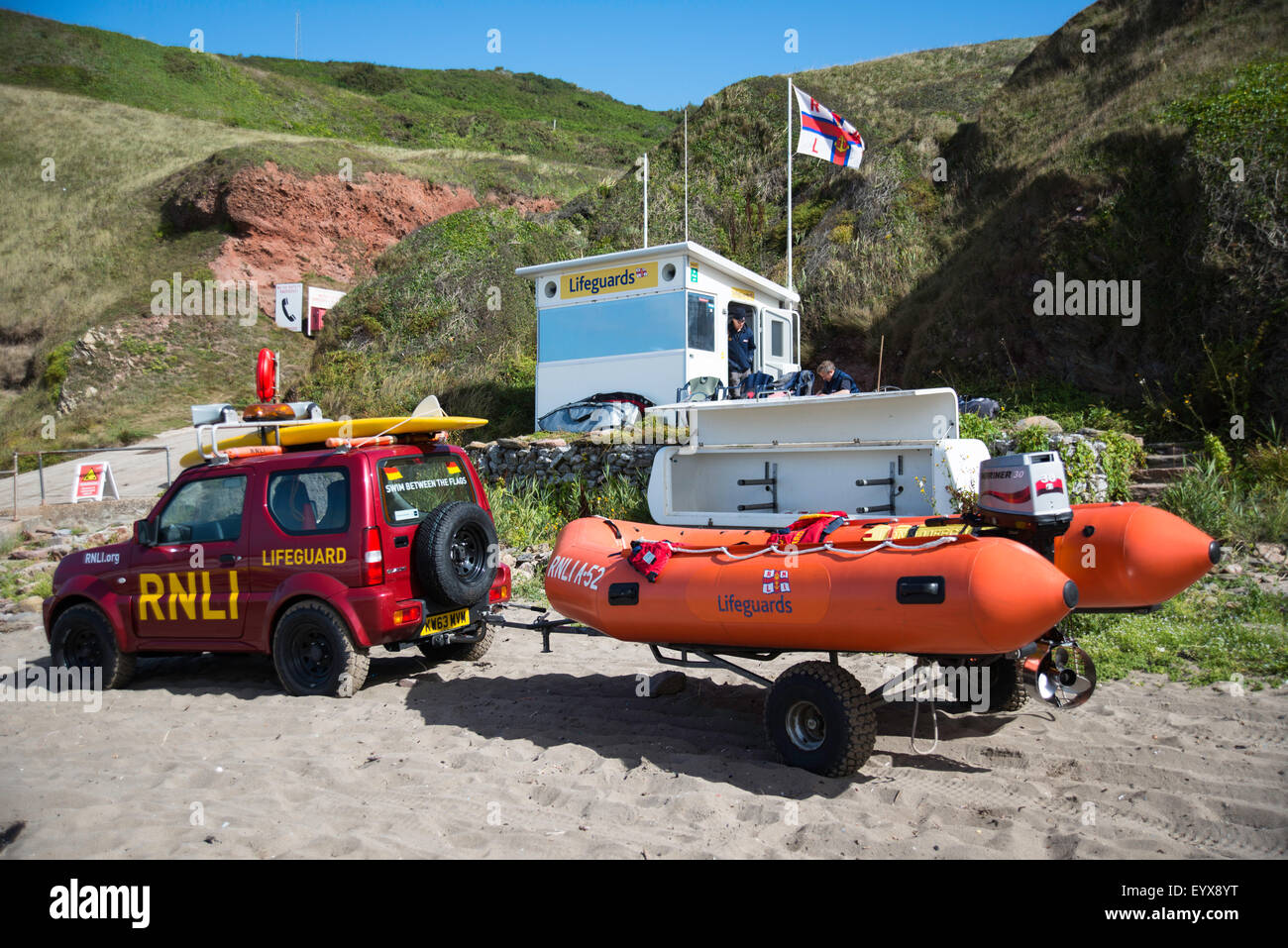 Surf lifesaving, warning flags and equipment on beach ready for use by ...