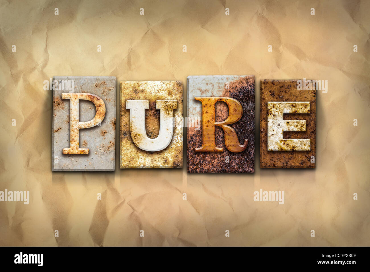 The word "PURE" written in rusty metal letterpress type on a crumbled ...