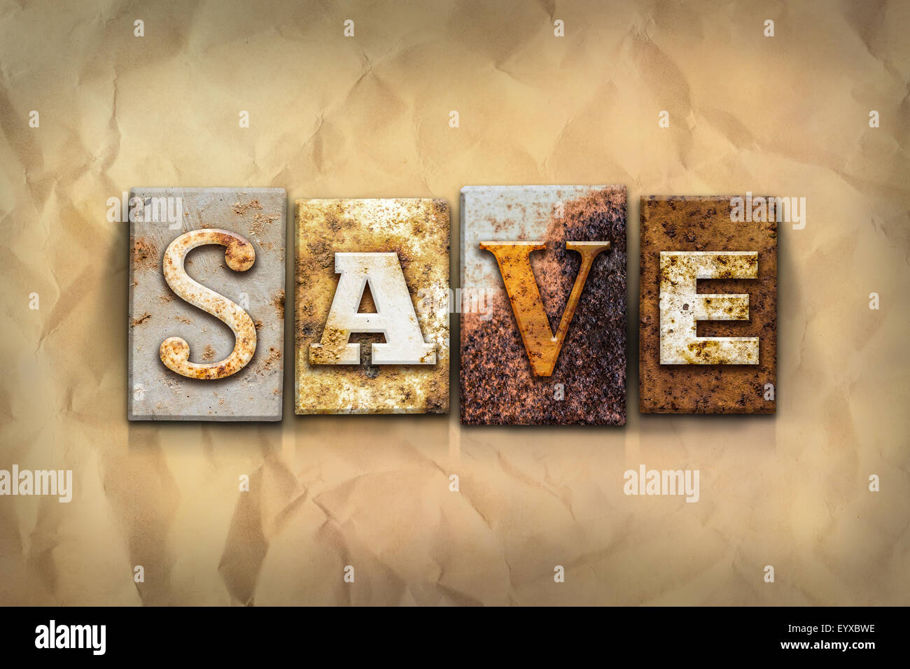 The word "SAVE" written in rusty metal letterpress type on a crumbled ...