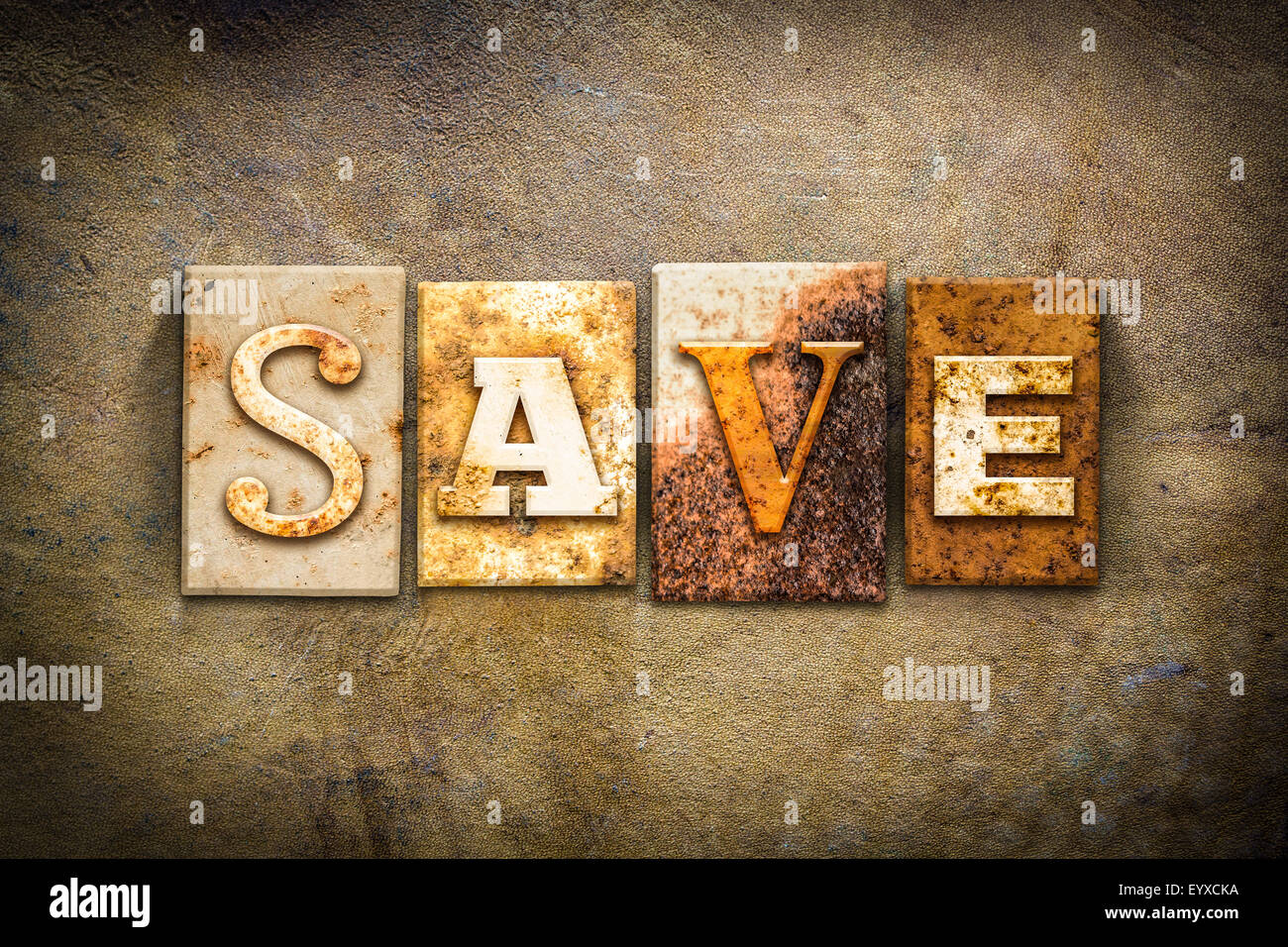 The word "SAVE" written in rusty metal letterpress type on an old aged ...